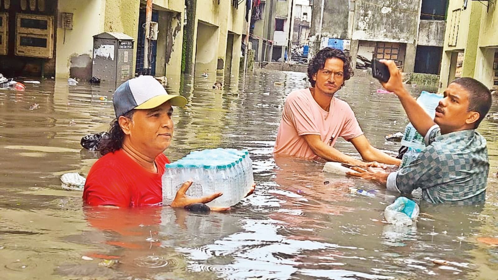 Wading through chest-deep water, how fire dept came to rescue of flood-hit Surat resident in ...